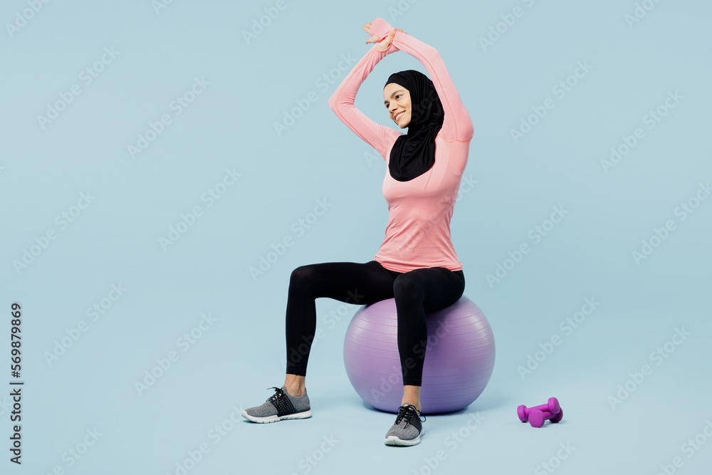 Full body young asian muslim fitness trainer sporty woman wears pink ...