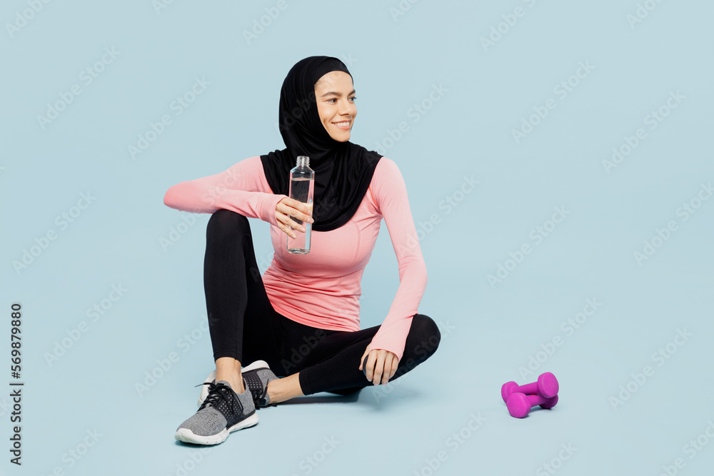 Full body young asian muslim fitness trainer sporty woman wear pink ...