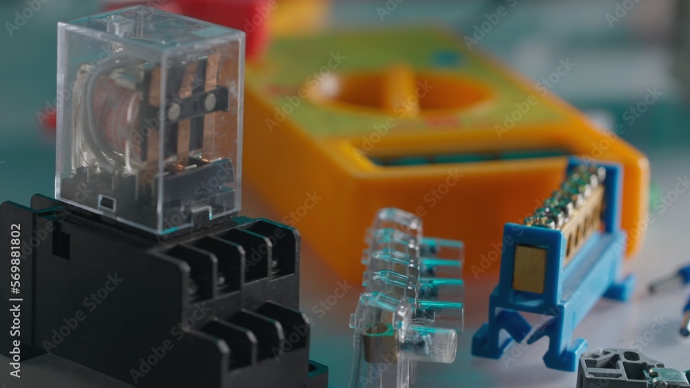 Yellow multimeter and relay with electromagnetic coils of direct and ...