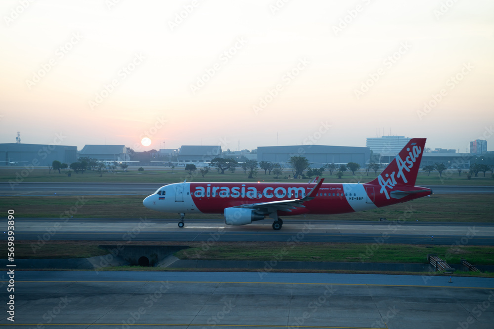 This is a view of an Air Asia aircraft in the morning, registered as HS ...