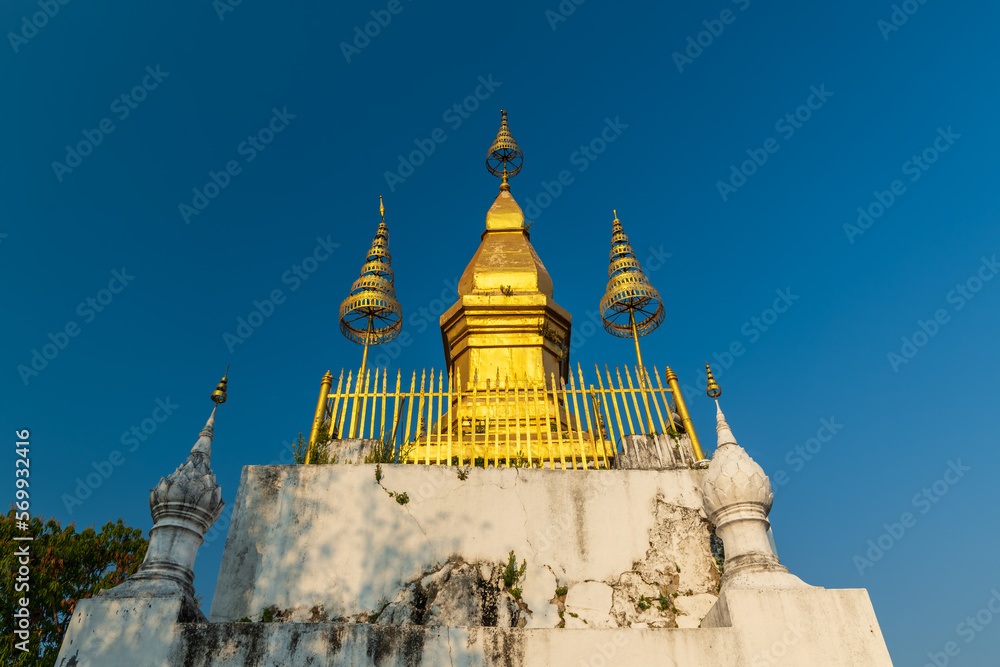 Golden pagoda of Wat Chom Si on the top of Phousi Hill, A high hill in ...