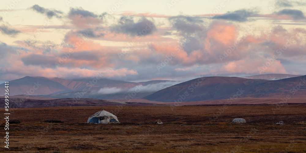 Picturesque arctic landscape. Yaranga (home of nomadic reindeer herders ...