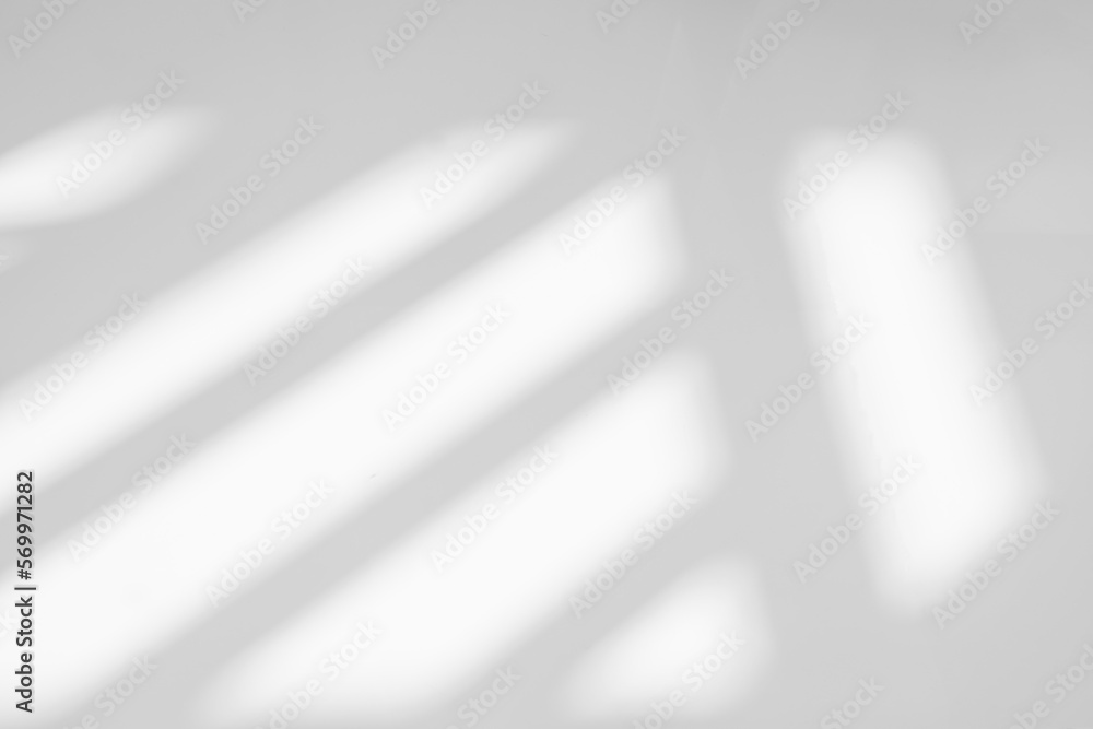 Abstract light reflection and grey shadow from window on white wall ...