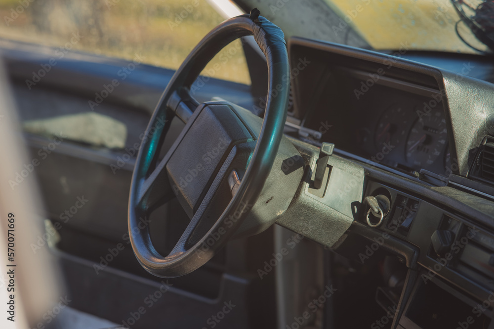 Old and worn steering wheel of an older car. Rectangular shape of ...