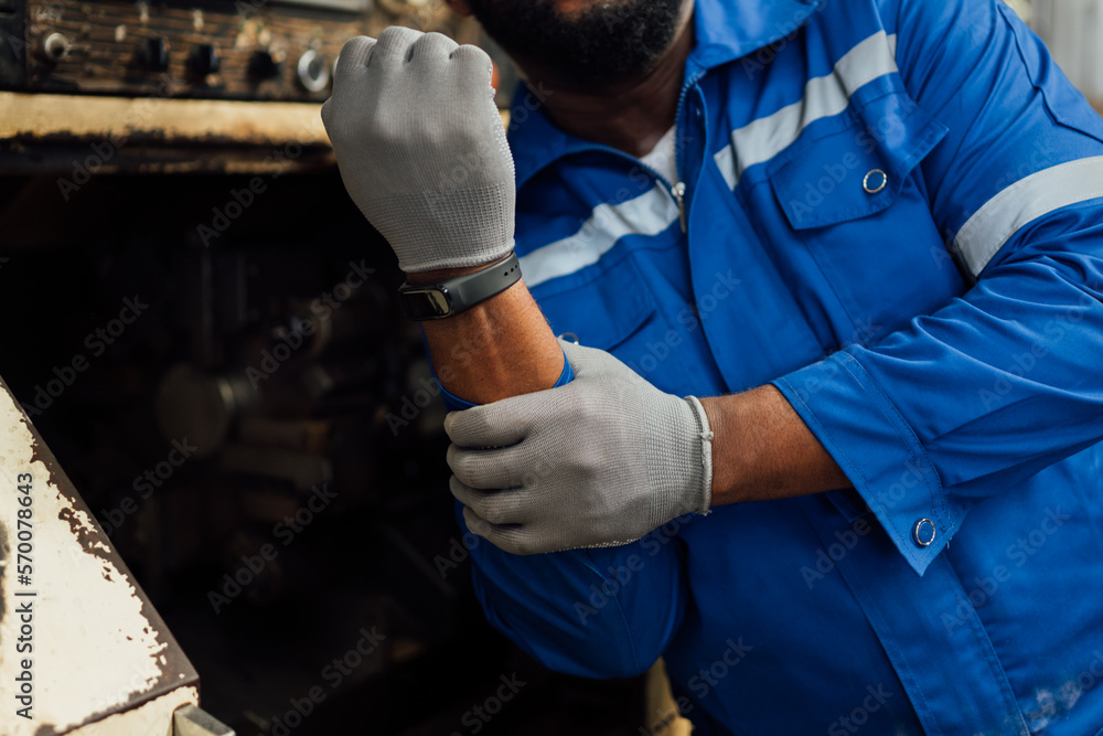Worker with accident concept, worker with arm injury from machine ...