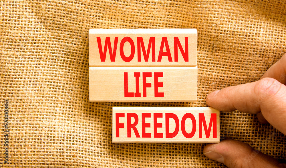 Woman life freedom symbol. Concept words Woman Life Freedom on wooden ...
