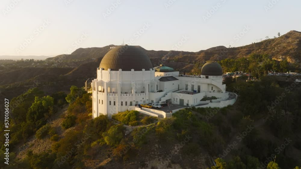 Drone flying around the Griffith Observatory in green park on Hollywood ...
