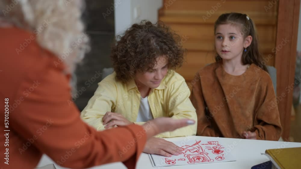 Caucasian daughter and son excusing as irritated mother pointing at ...