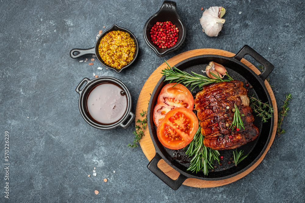 Homemade Crispy Pork Belly or Deep Fried Pork in a roll on a dark ...