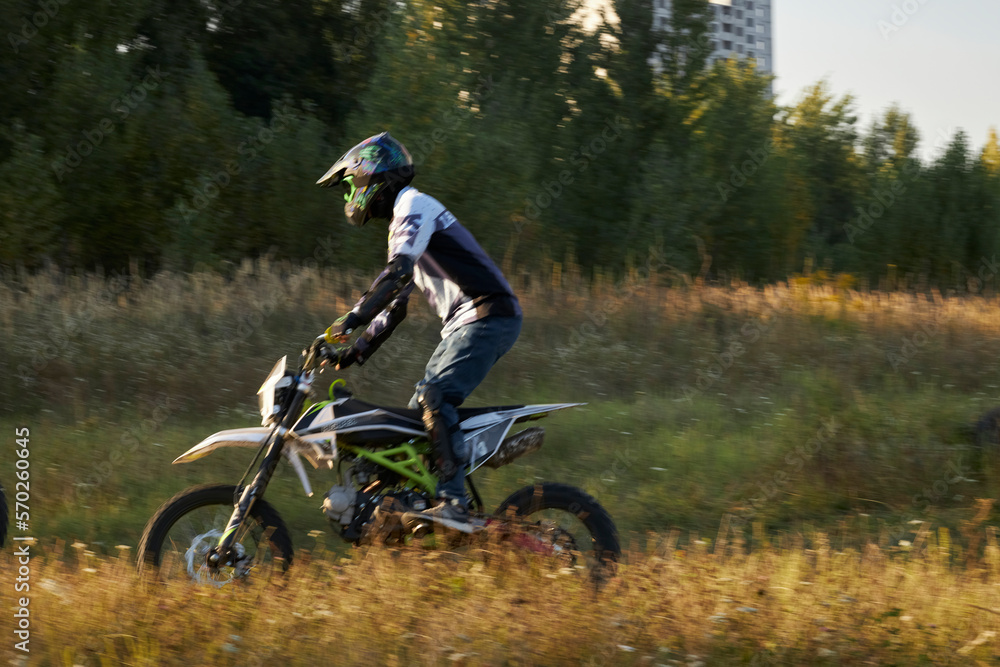 Enduro rider on an enduro motorcycle. Photo of an enduro rider. a ...