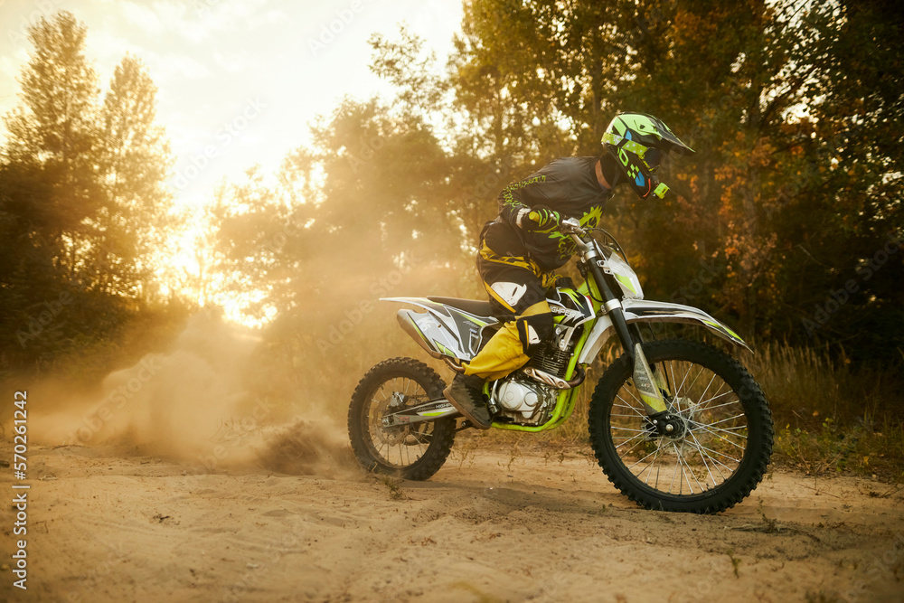 Enduro rider on an enduro motorcycle. Photo of an enduro rider. a ...