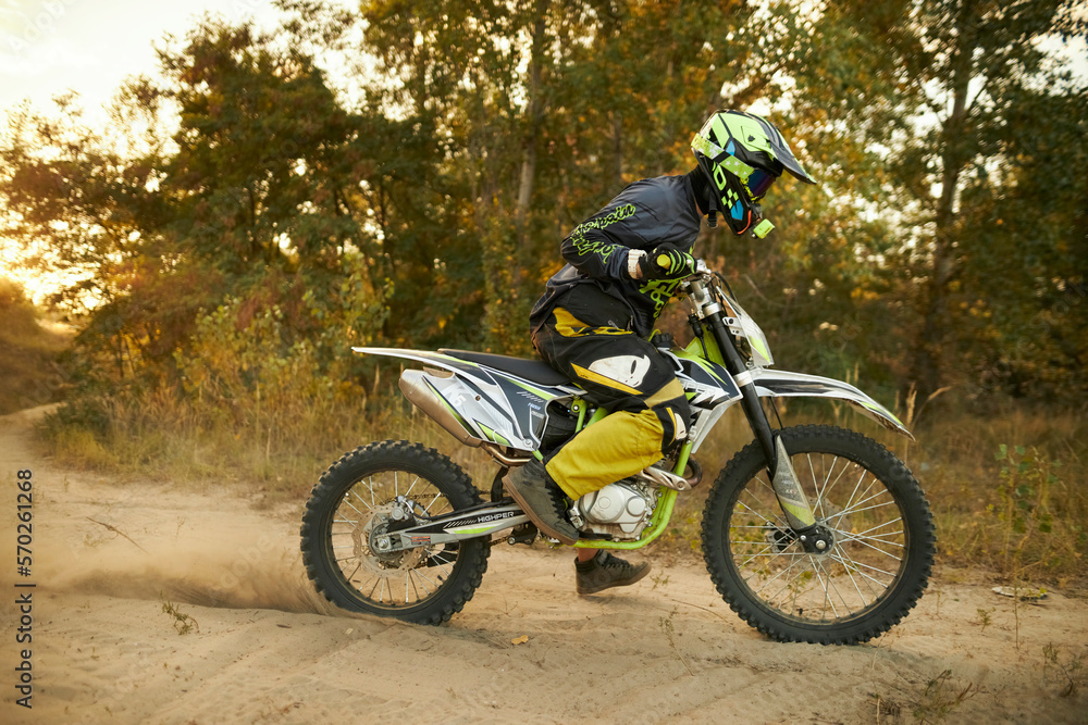 Enduro rider on an enduro motorcycle. Photo of an enduro rider. a ...
