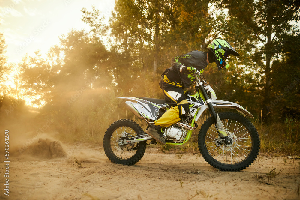 Enduro rider on an enduro motorcycle. Photo of an enduro rider. a ...