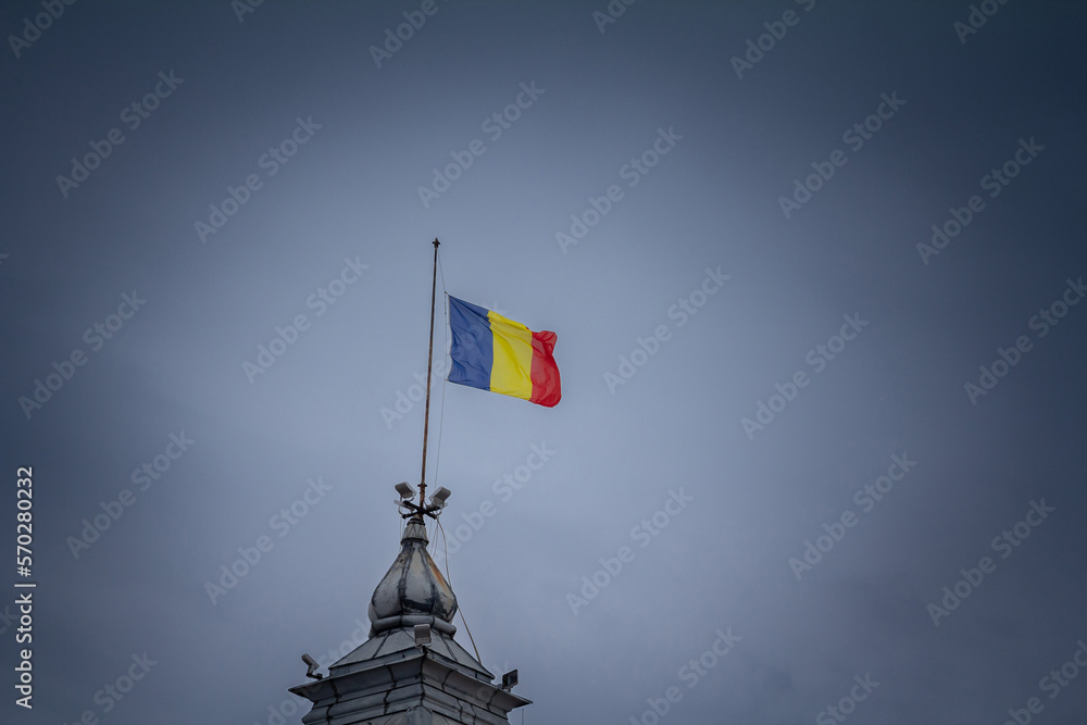 Flag of Romania, also called Drapelul Romaniei waiving on a flagpole of ...