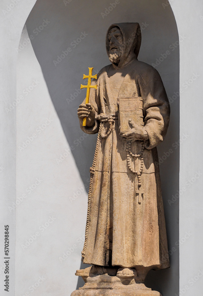Catholic Monk from Capuchin order with a two-barred cross and Bible ...