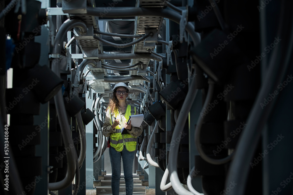 Engineer female checking on Air condition plant. Two worker working on ...