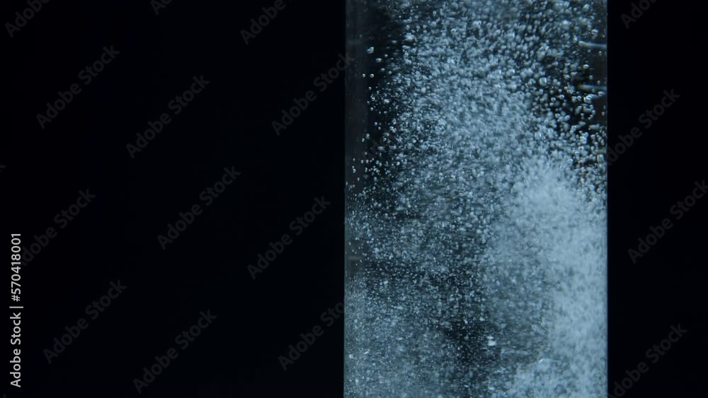 Reaction in water. Boiling and fizzing of ingredients in liquid ...