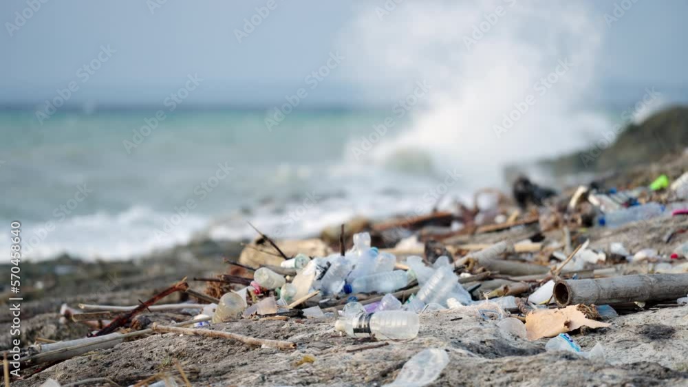 Plastic bottles litter polluted beach. Example of plastic in ocean and ...