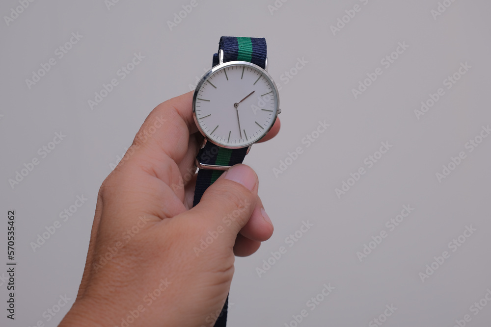 Hand showing an old model of wrist watch over plain background Stock ...