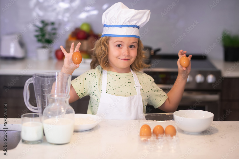 Kid chef cook with eggs at kitchen. Funny kid chef cook cookery at ...