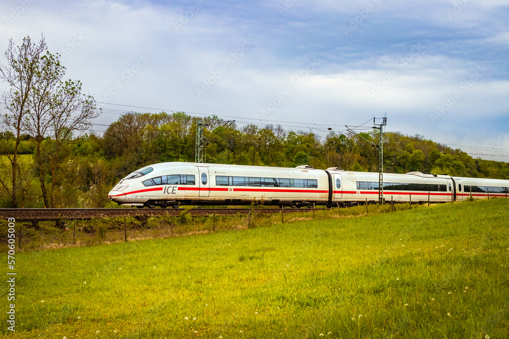 German high-speed train ICE (Intercity-Express) in sunny natural ...