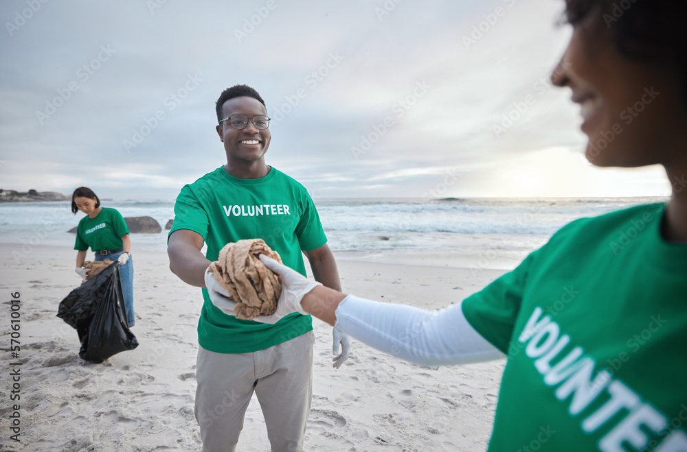 Teamwork, help and recycling with people on beach for sustainability ...
