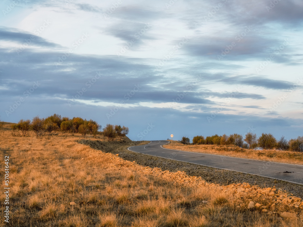 Empty morning highway through the pass, right turn . Beautiful asphalt ...