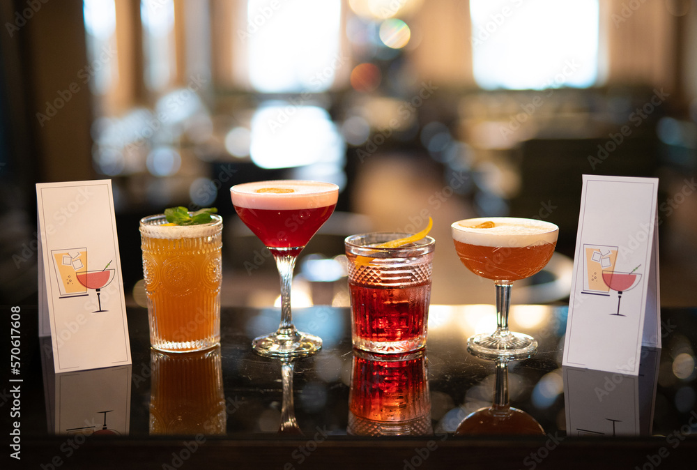 beautiful and delicious alcoholic cocktails prepared at the bar by the ...