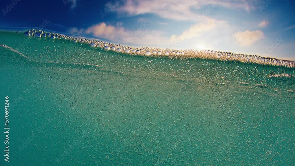 Calm sea splitted view with gentle wave, above and underwater view of ...