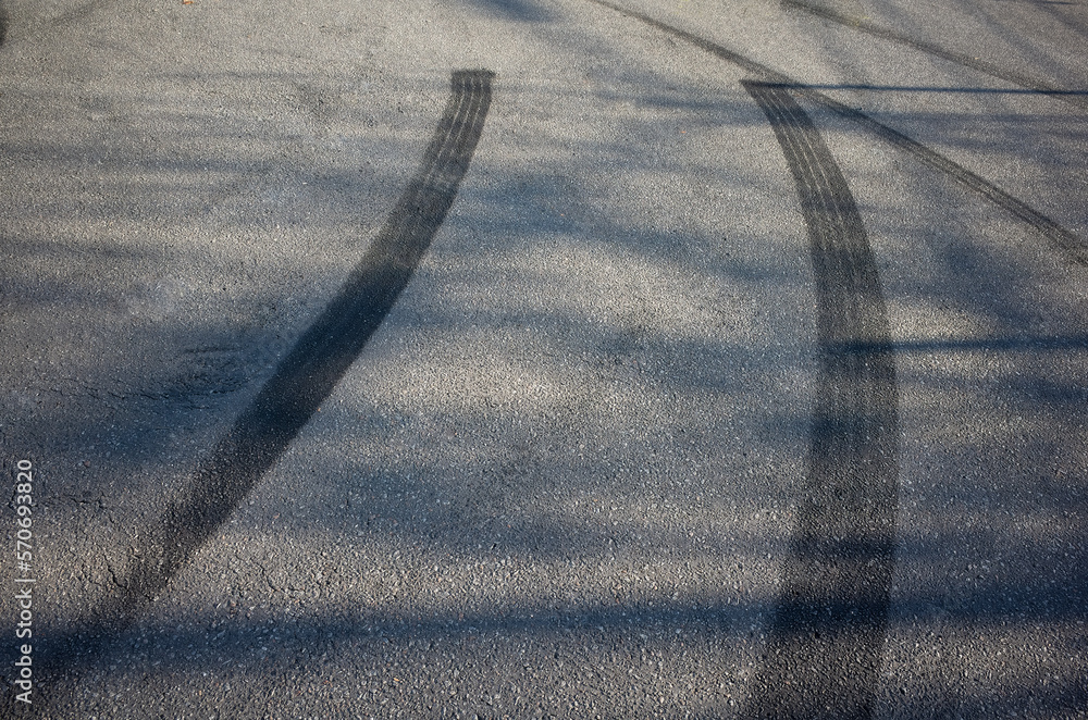 skid marks on a road surface. tire marks left by drivers doing burnouts ...