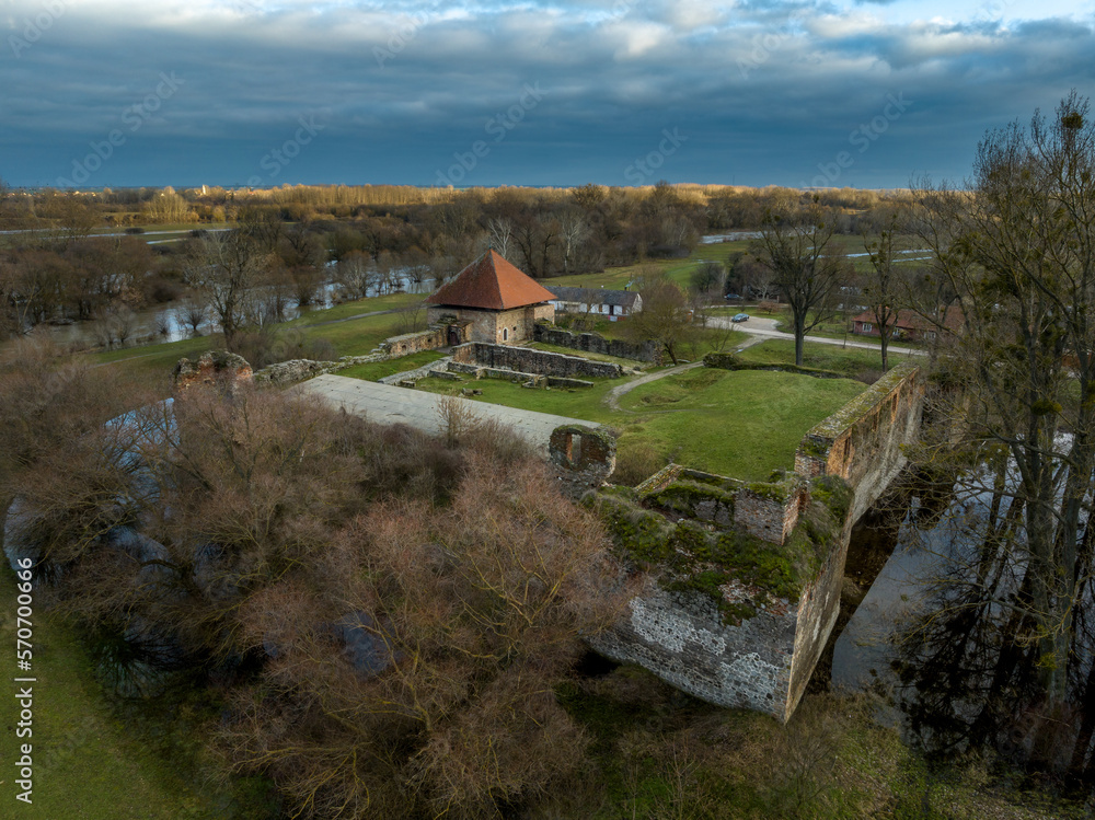 Aerial view of medieval Onod castle ruin, surrounded by a water filled ...