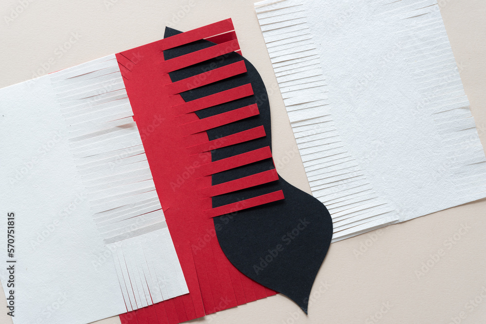 combined abstract white, red, and black paper shapes - some with fringe ...