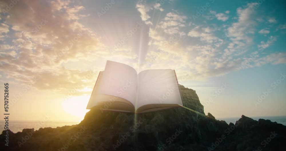 Holy Bible printed open sacred book against sunset sky natural ...