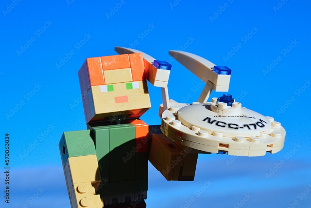 LEGO Minecraft action figure of Alex holding Star Trek model of ...