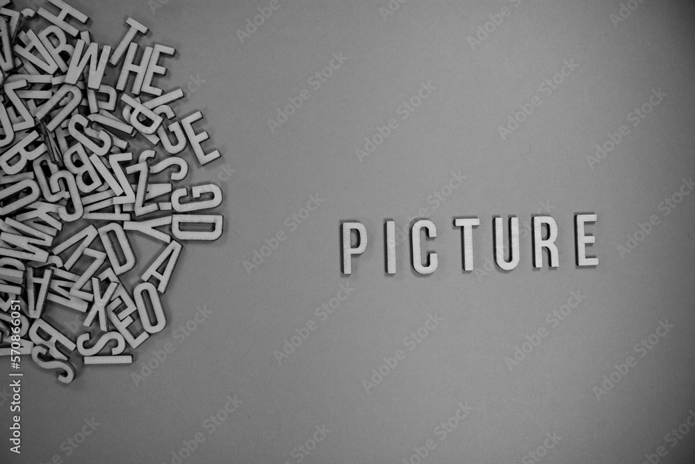 PICTURE in wooden English words language capital letters spilling from ...