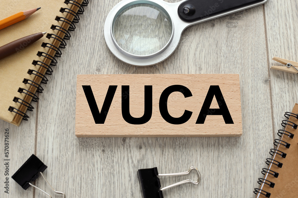 VUCA Symbol. Wooden Circle with acronym VUCA - volatility, uncertainty ...