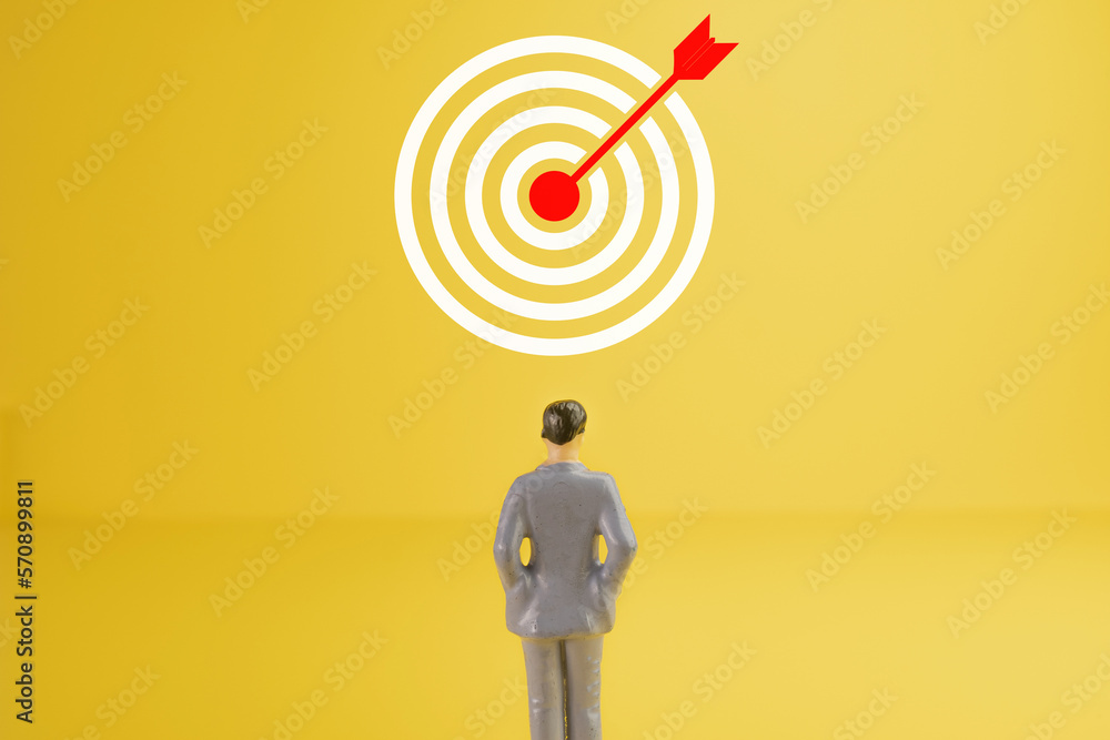 Business Man Focus on Target dart board icon over yellow background use ...