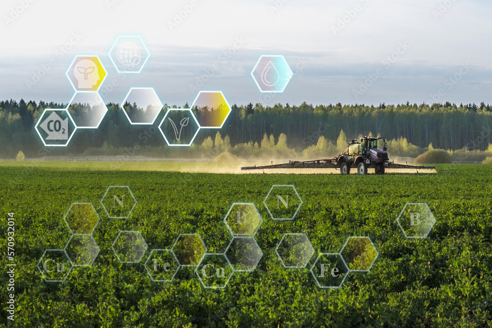 tractor sprays fertilizer. Irrigation, pest control, crop enhancement ...