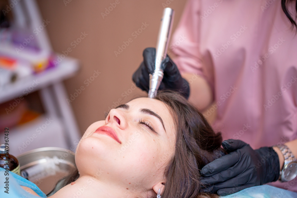 Treatment of the scalp for hair loss, alopecia. A trichologist doctor ...