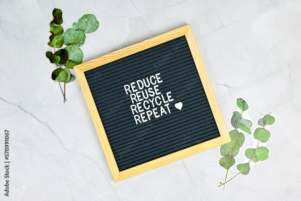 Letter board with quote Reduce Reuse Recycle and repeat with pepermint leaves. Environmental ...