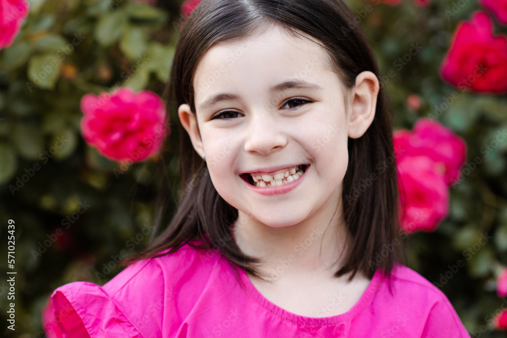 Smiling child girl 7-8 year old show her new permanent teeth in dental ...