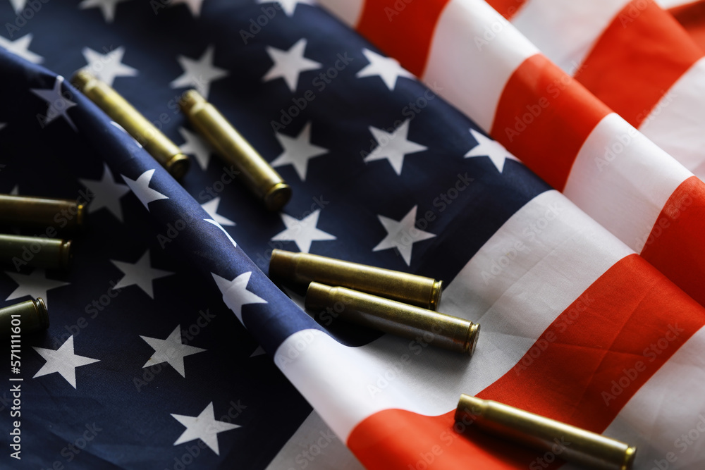 many shell casings from bullets of different caliber in the background ...