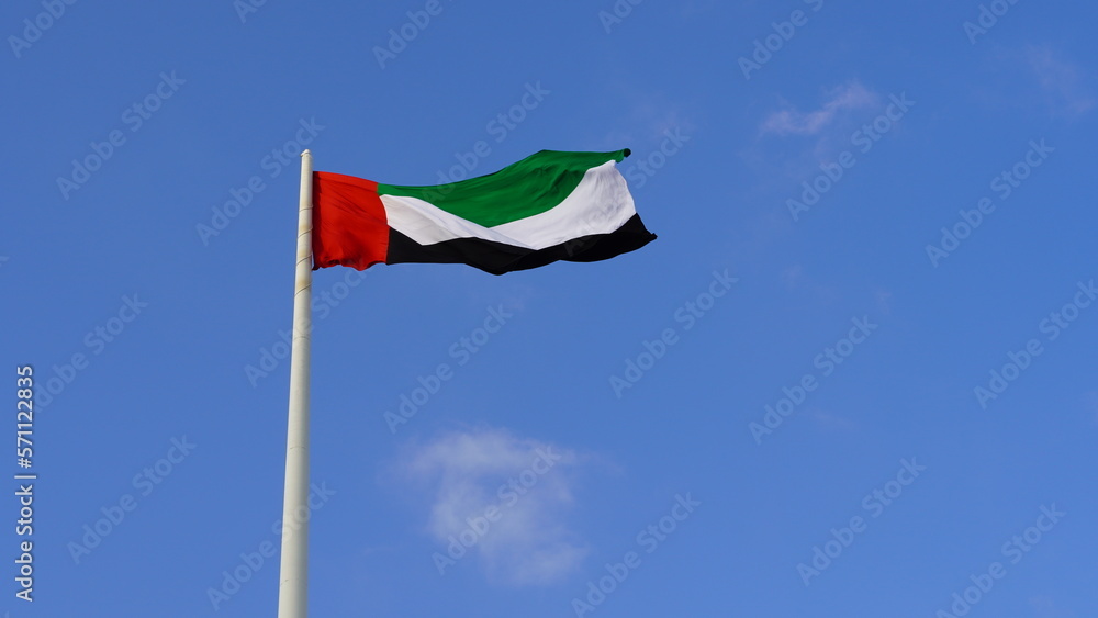 United Arab Emirates National flag against blue sky. Flag day, National ...