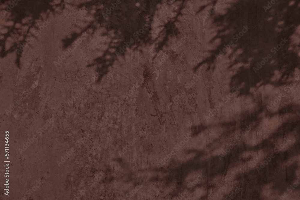 Foto de Abstract tree leaves shadows on brown concrete wall texture ...