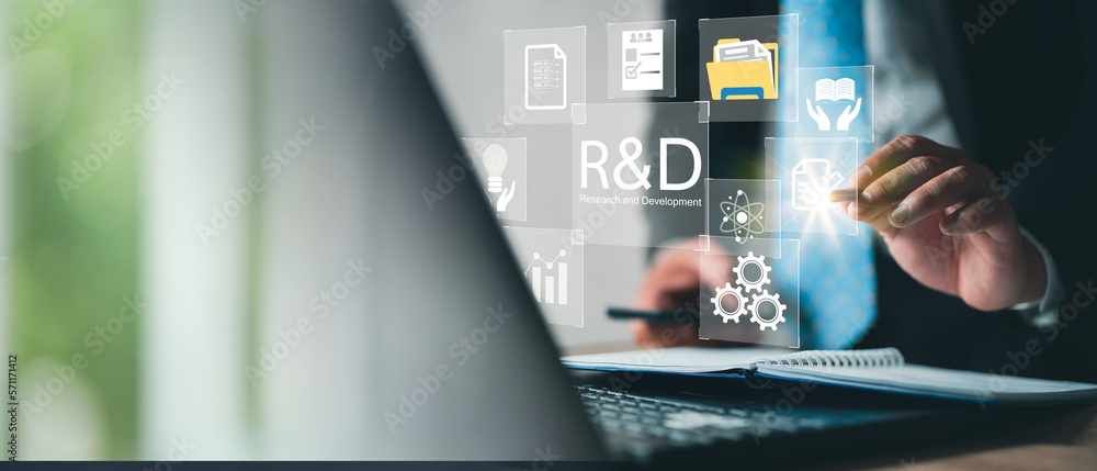 Businessman use a computer with the R and D icon for Research and ...