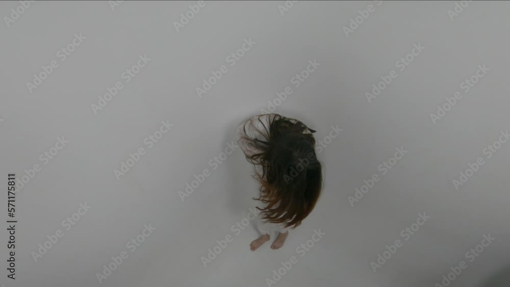 Cinematic footage of unrecognizable girl with face covered with long ...