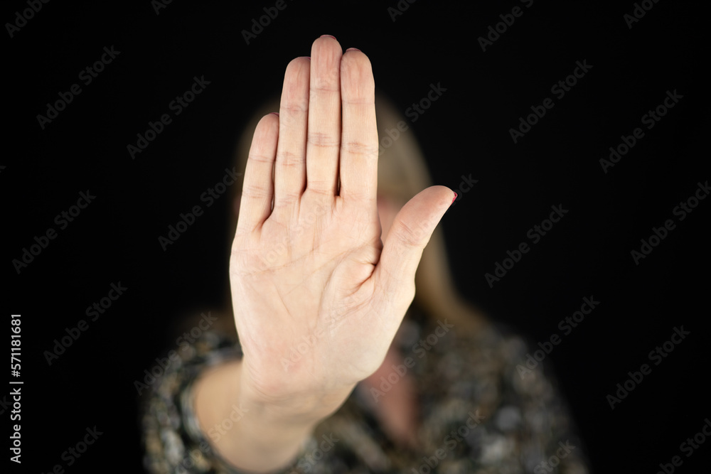 Woman showing hand stop sign to campaign against gender violence and ...