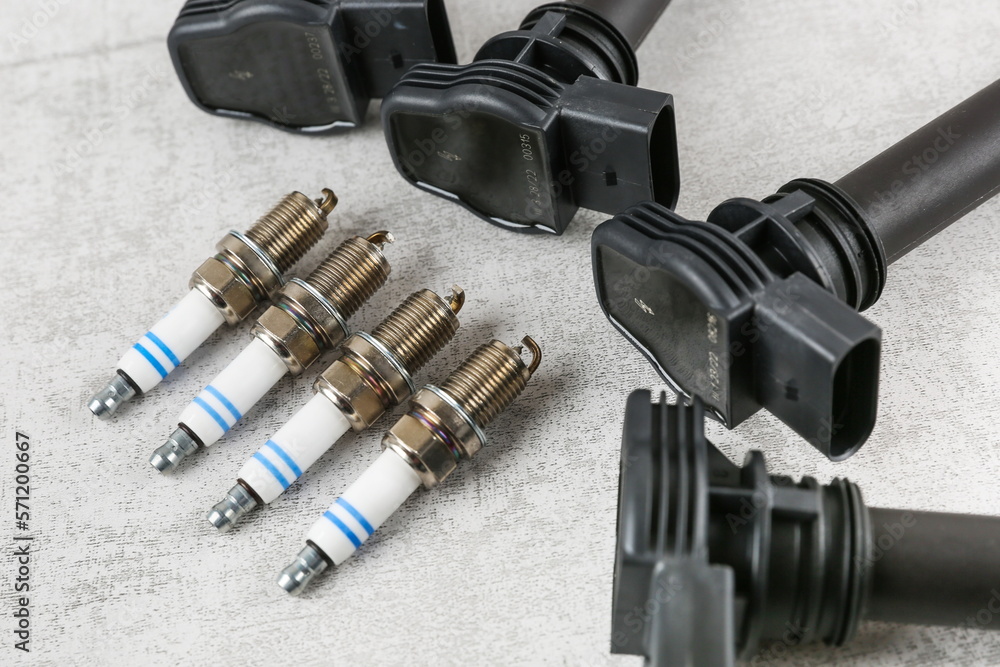spark plugs and ignition coils top view. new car parts close up. Stock ...