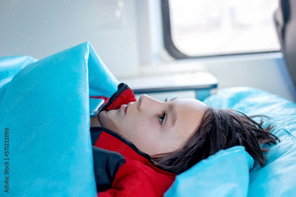 Foto de Preteen child, boy, lying in ambulace, being transported to the ...