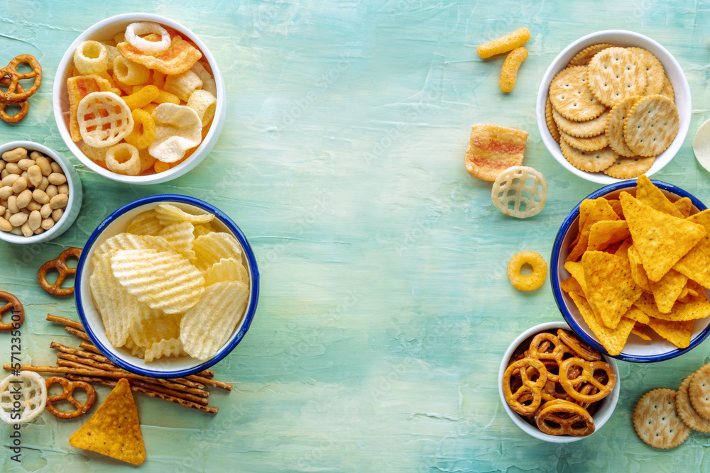 Salty snacks, overhead flat lay background with copy space. Party food ...